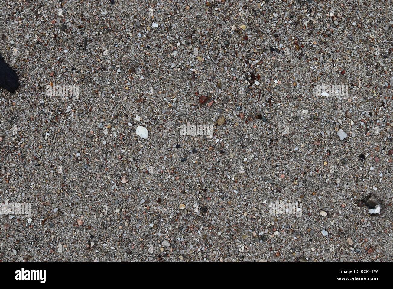 Close up high resolution surface of sand with footprints on the ground ...