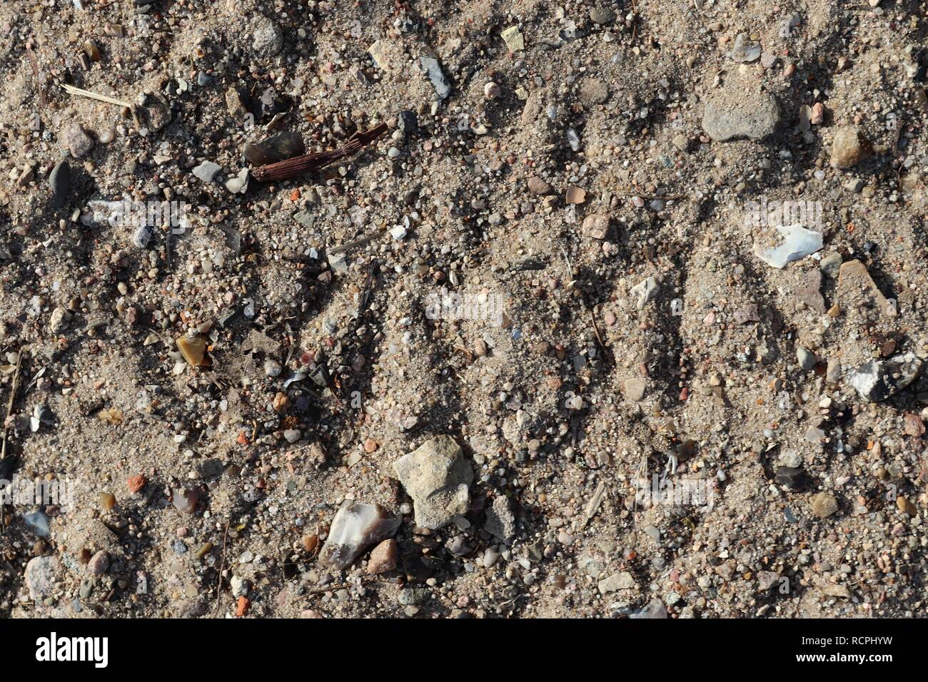 Close up high resolution surface of sand with footprints on the ground ...