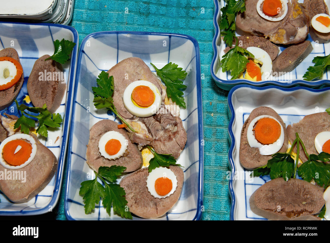 Close-up ingredients for jellied tongue that are arranging in ...
