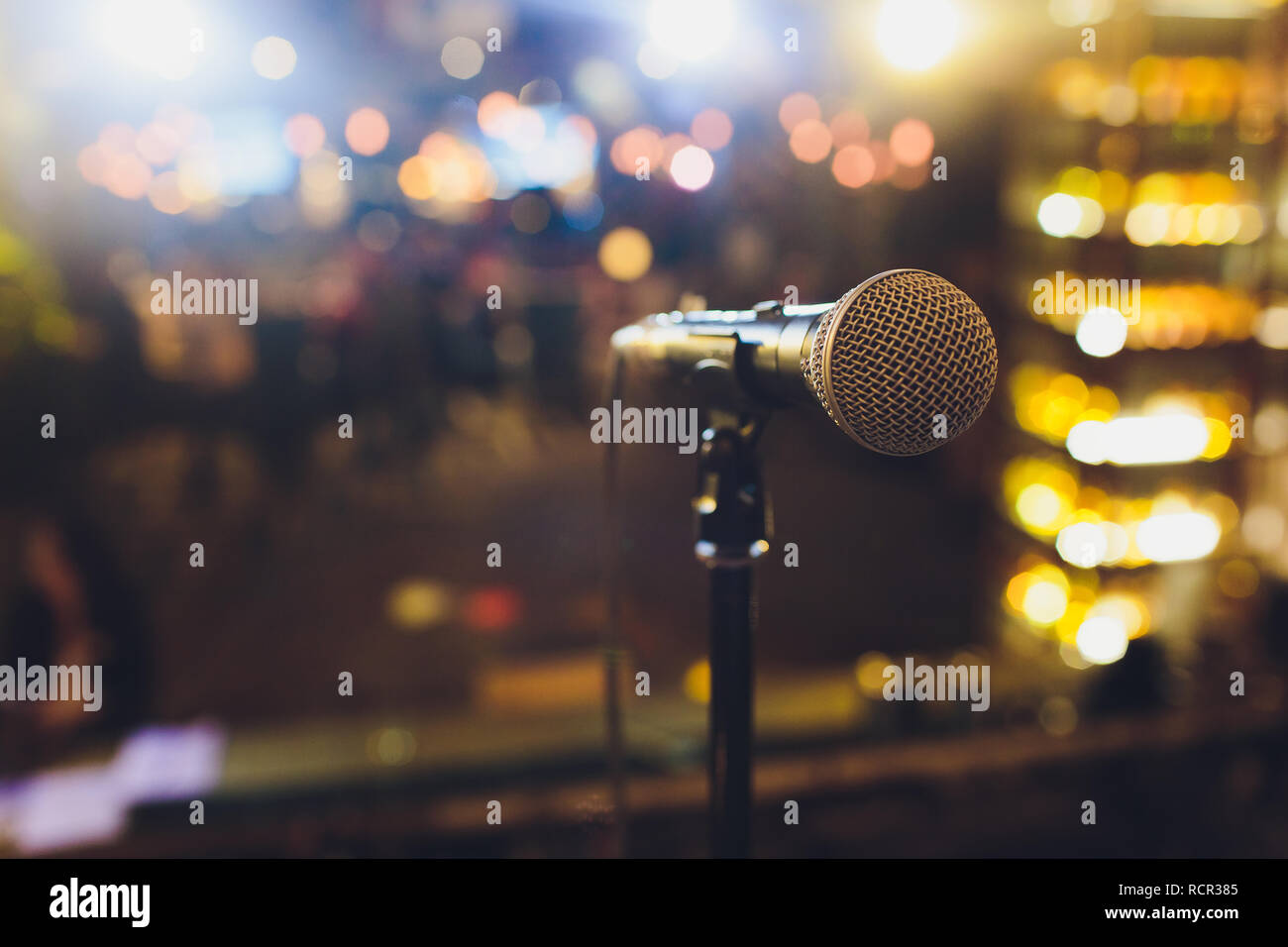 Close up microphone on stage in concert hall restaurant or conference ...