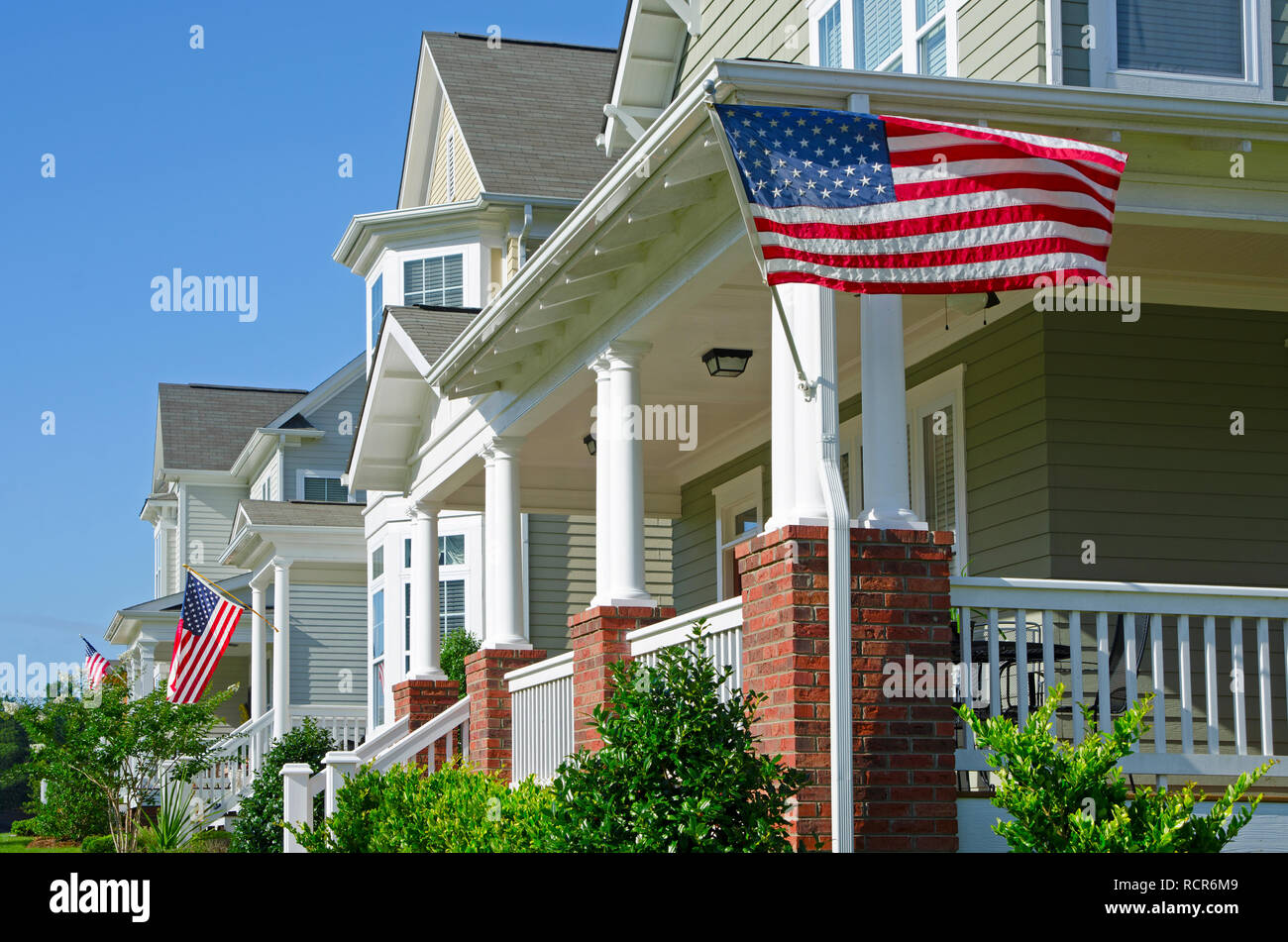 Row of Homes Flying the American Flag Stock Photo - Alamy