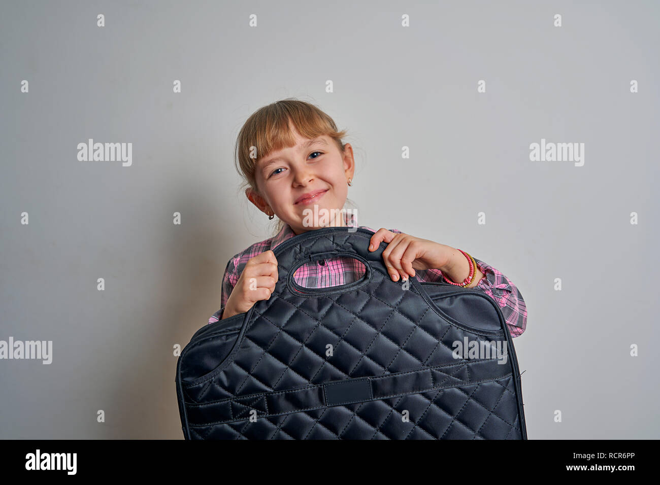 girl with briefcase on white background Stock Photo - Alamy