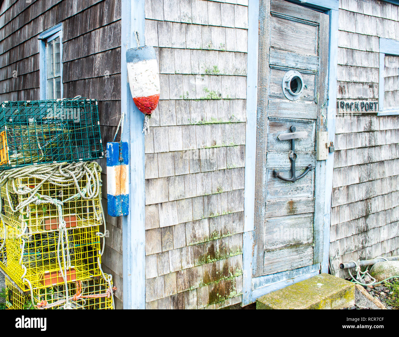 lobster traps stacked outside an ancient funky wood shingle fishing ...