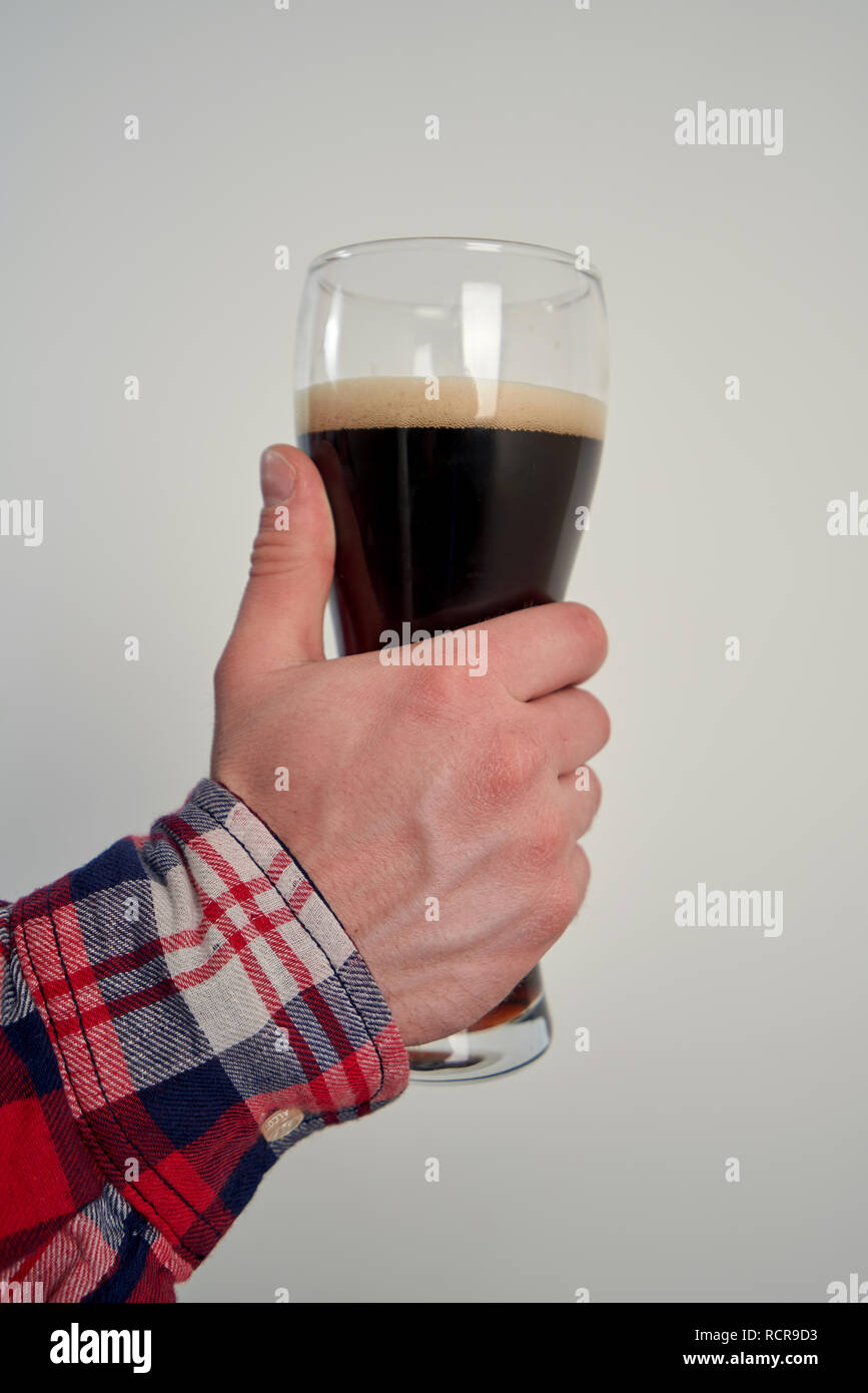 beer mug in hand on white background Stock Photo - Alamy