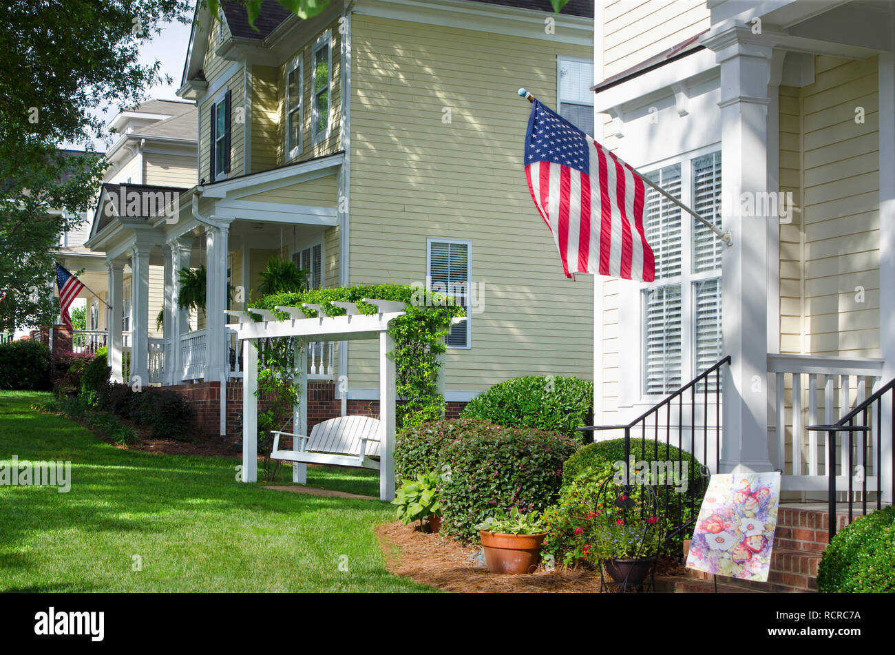 Row of Homes Flying the American Flag Stock Photo - Alamy