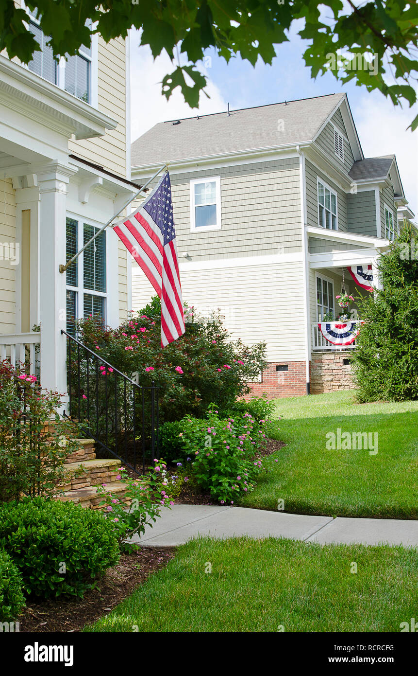 Row of Homes Flying the American Flag Stock Photo - Alamy
