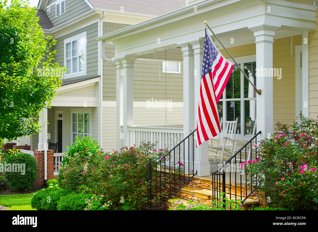 Row of Homes Flying the American Flag Stock Photo - Alamy
