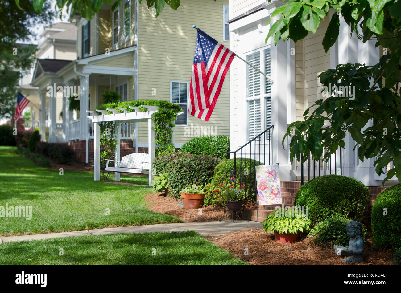 Row of Homes Flying the American Flag Stock Photo - Alamy