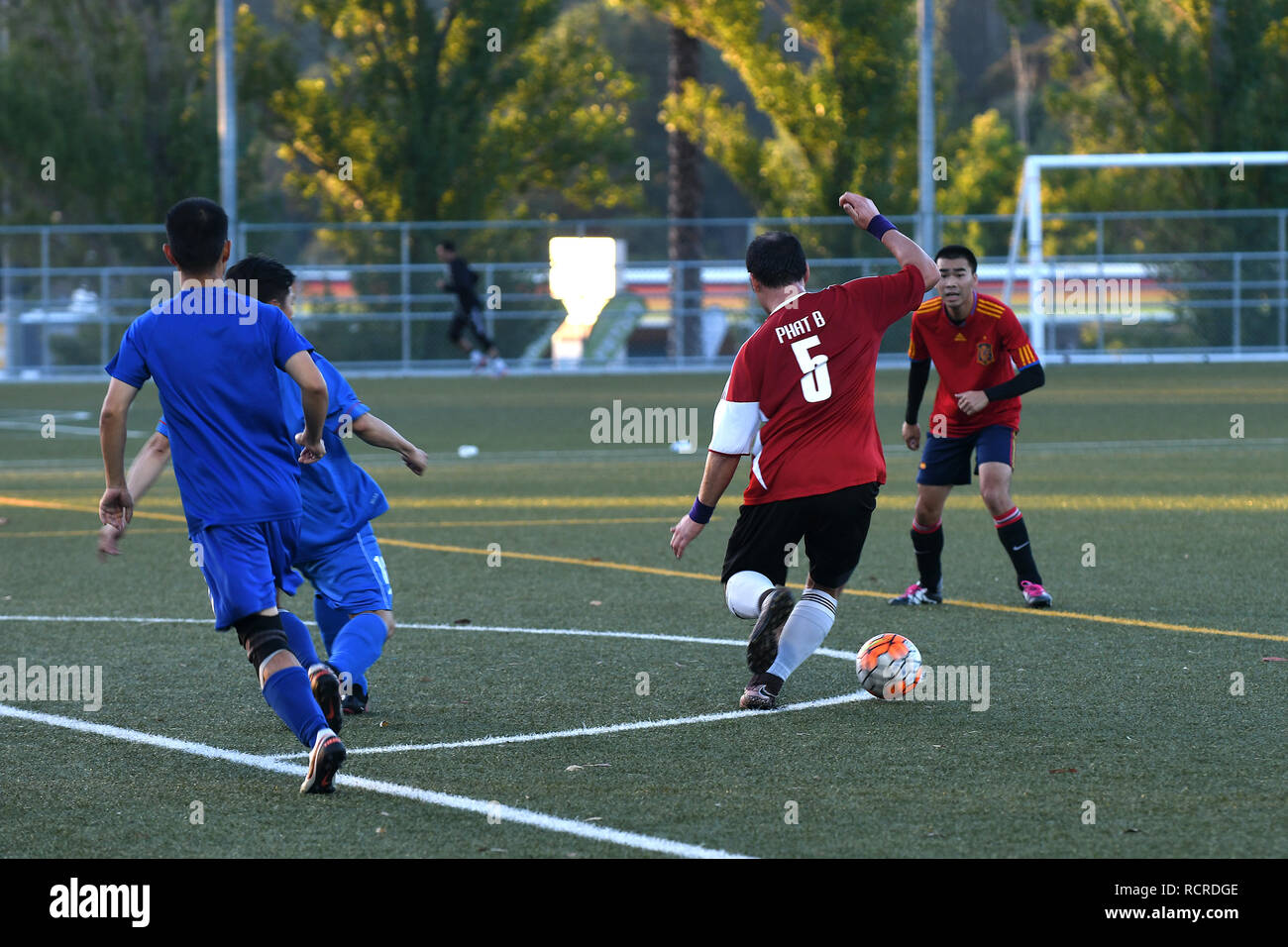 2 Chinese Teams having a friendly match in the evening Stock Photo - Alamy