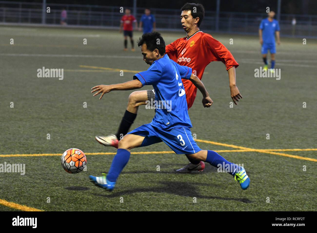 2 Chinese Teams having a friendly match in the evening Stock Photo - Alamy