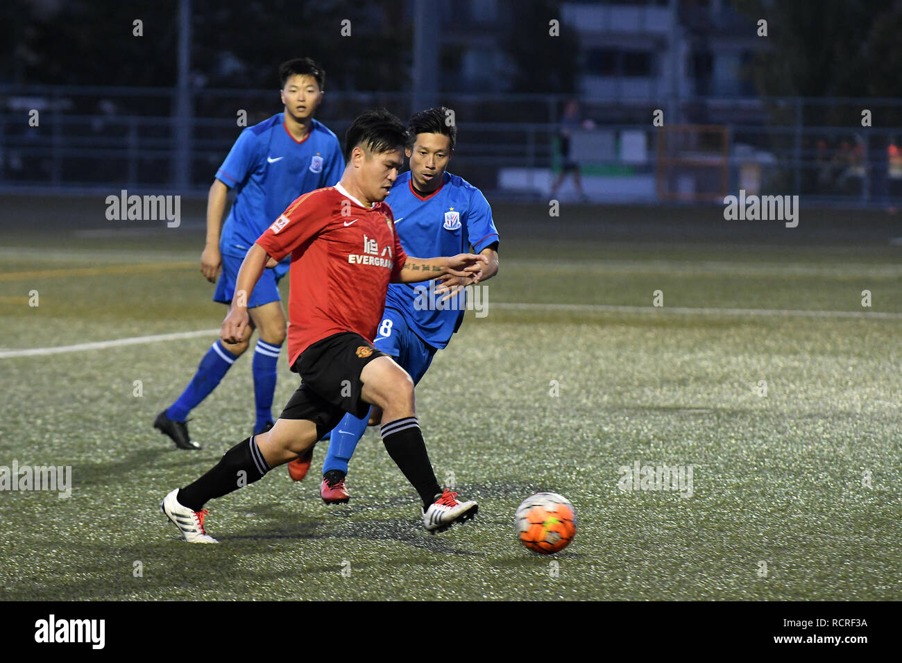2 Chinese Teams having a friendly match in the evening Stock Photo - Alamy