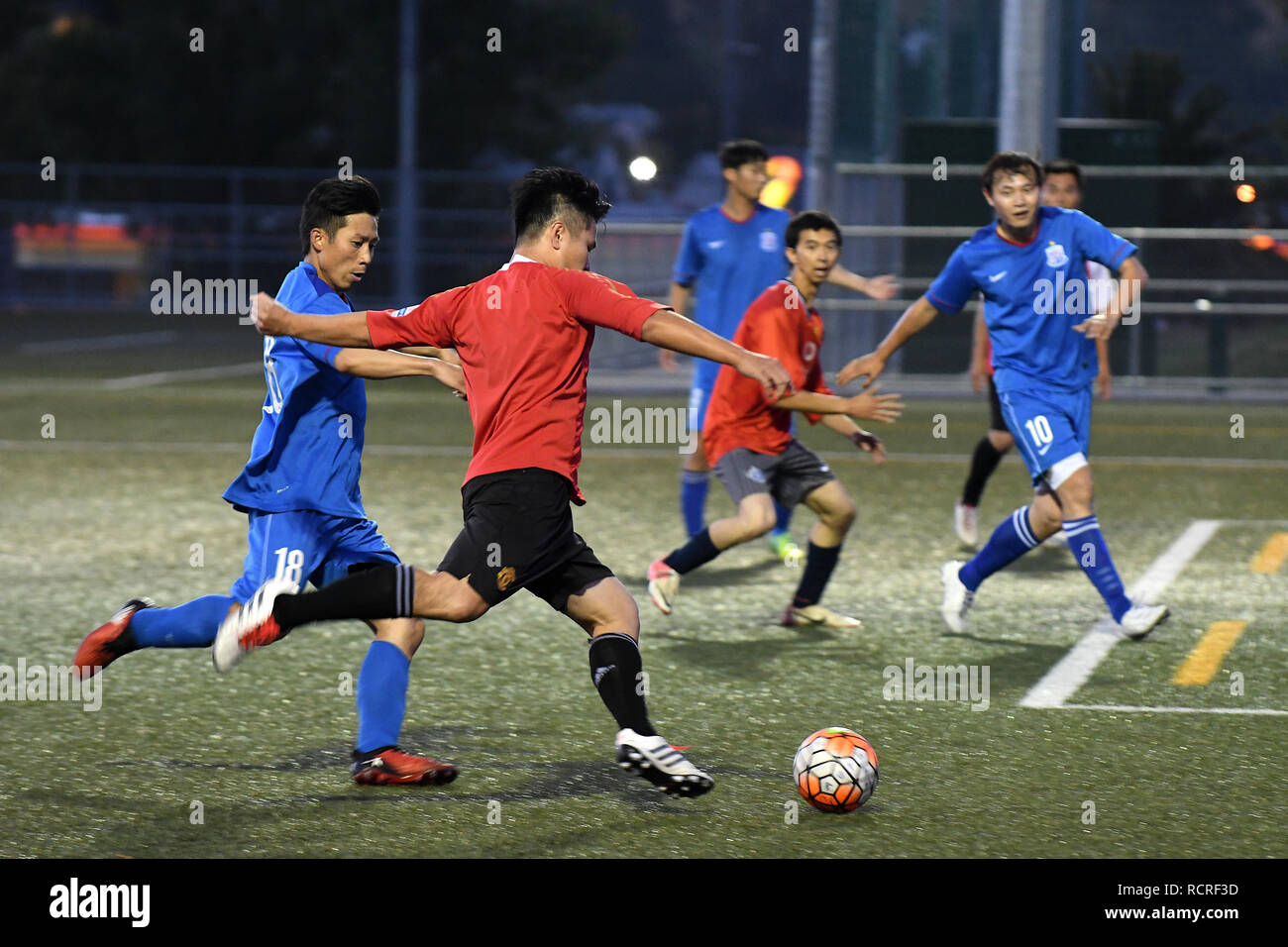 2 Chinese Teams having a friendly match in the evening Stock Photo - Alamy