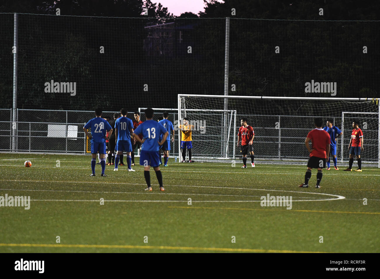 2 Chinese Teams having a friendly match in the evening Stock Photo - Alamy