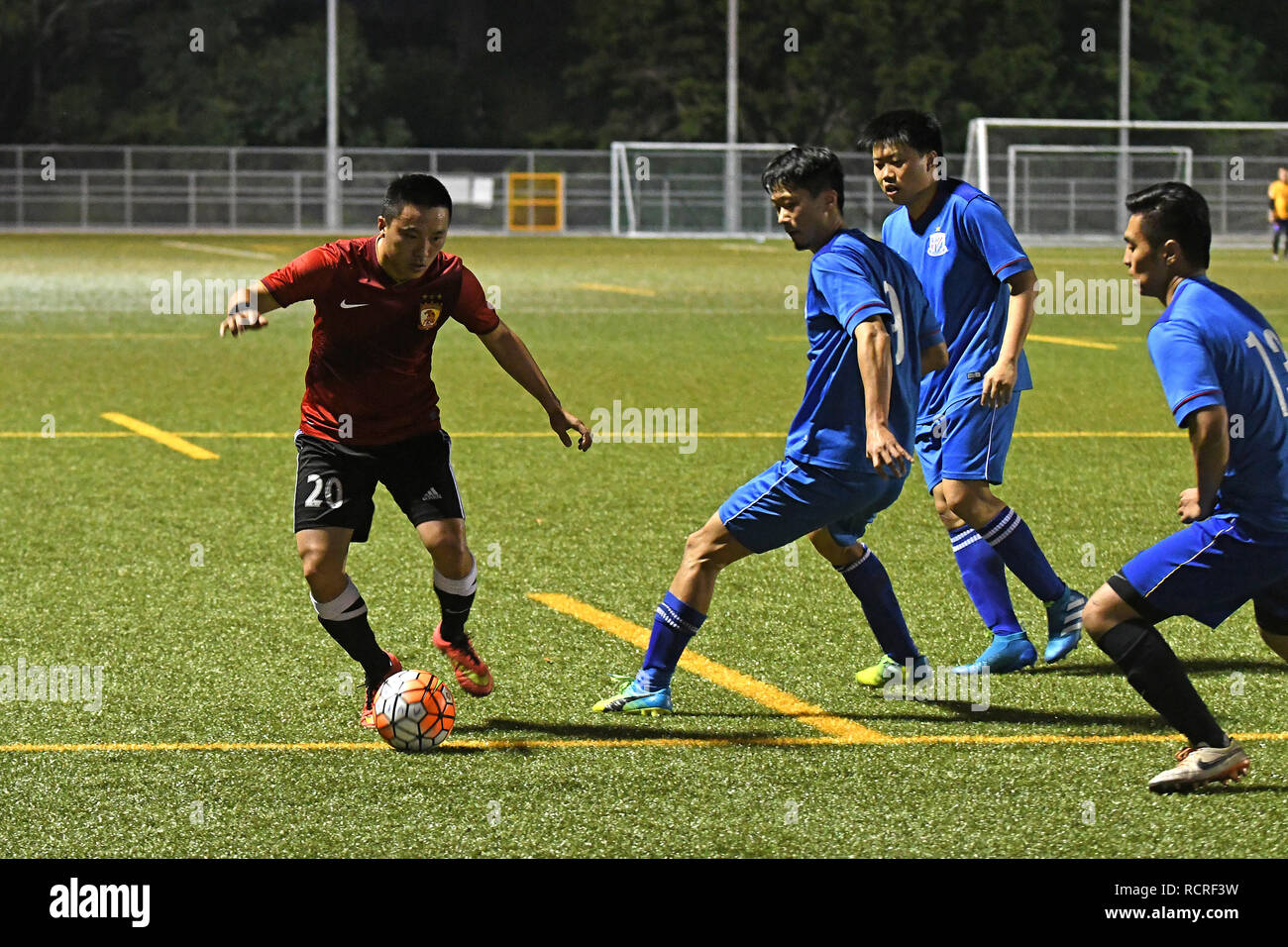 2 Chinese Teams having a friendly match in the evening Stock Photo - Alamy