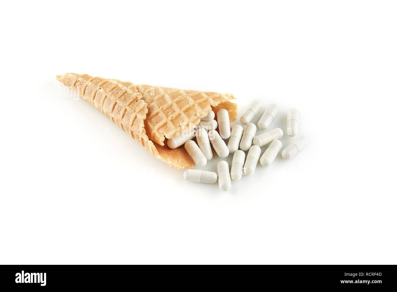Ice-cream cup with medicine. Isolated on white background Stock Photo ...