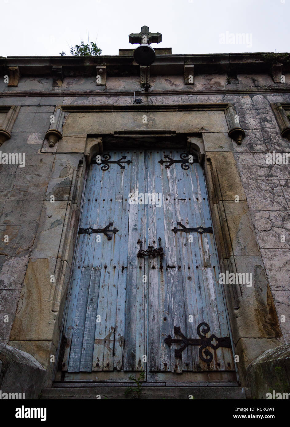 Blue grunge wooden church door in brick wall Stock Photo - Alamy