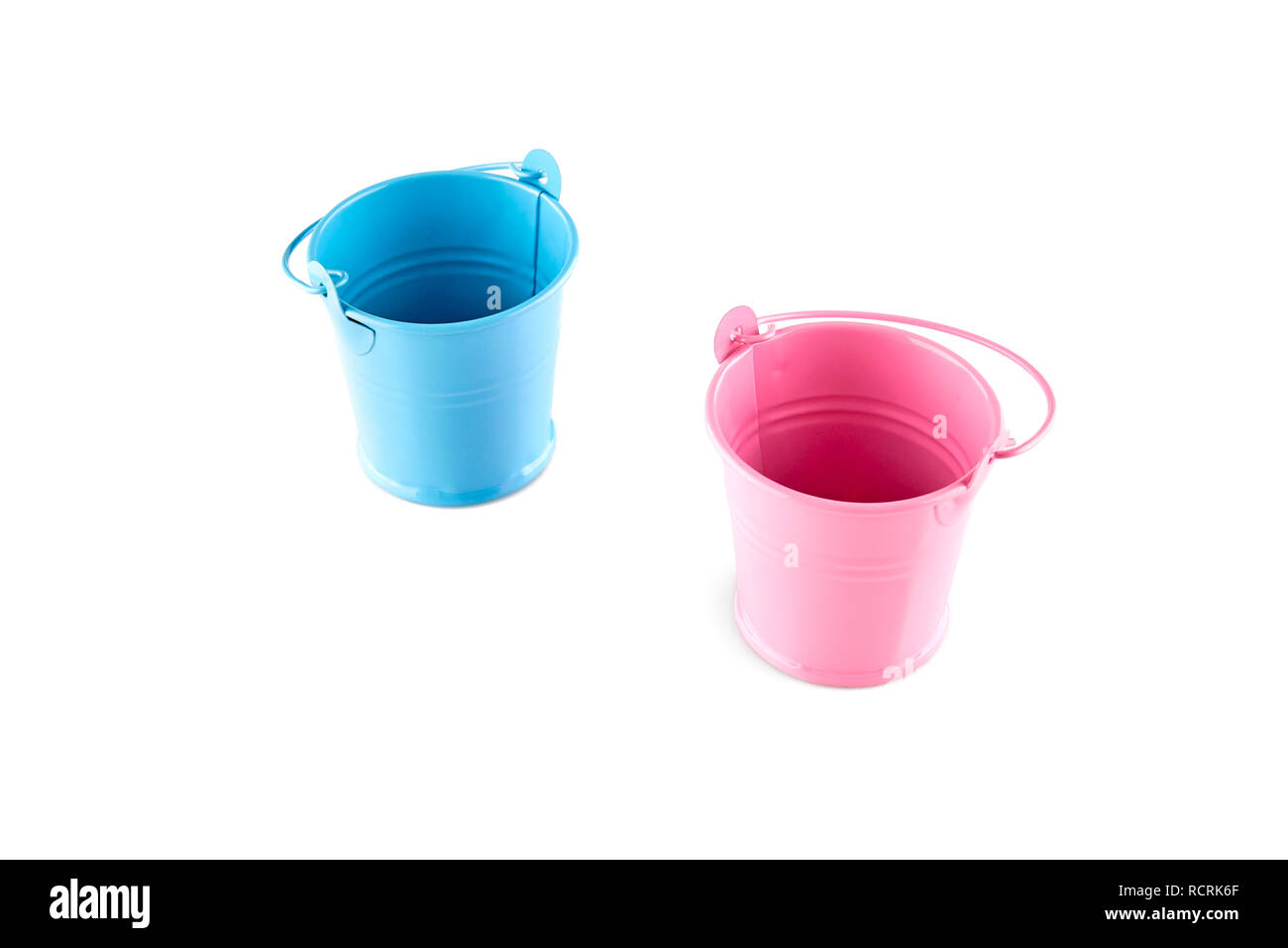 Small blue and pink buckets. Isolated on white background Stock Photo ...