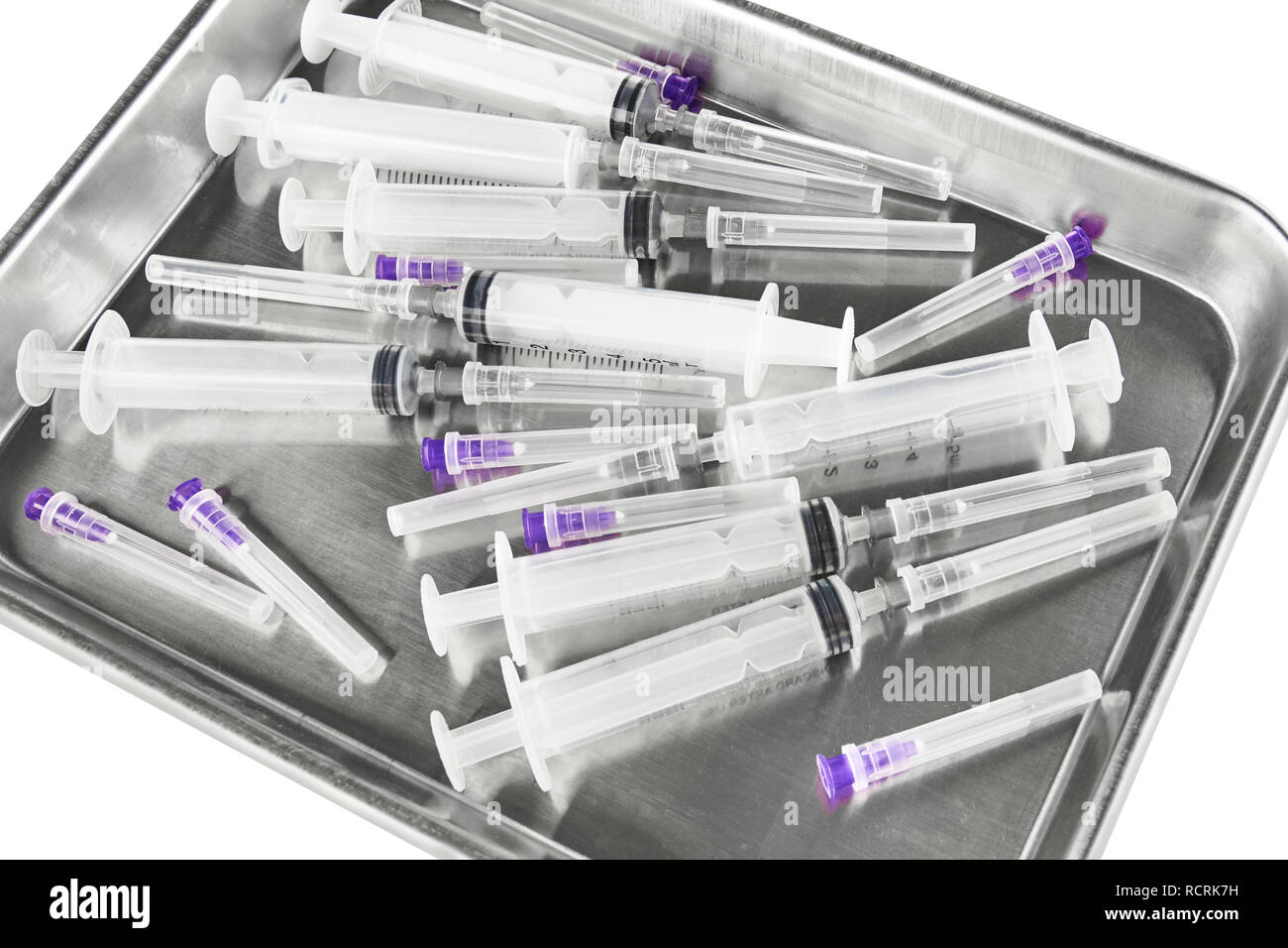 Metal salver with syringes and needles. Isolated on white background ...