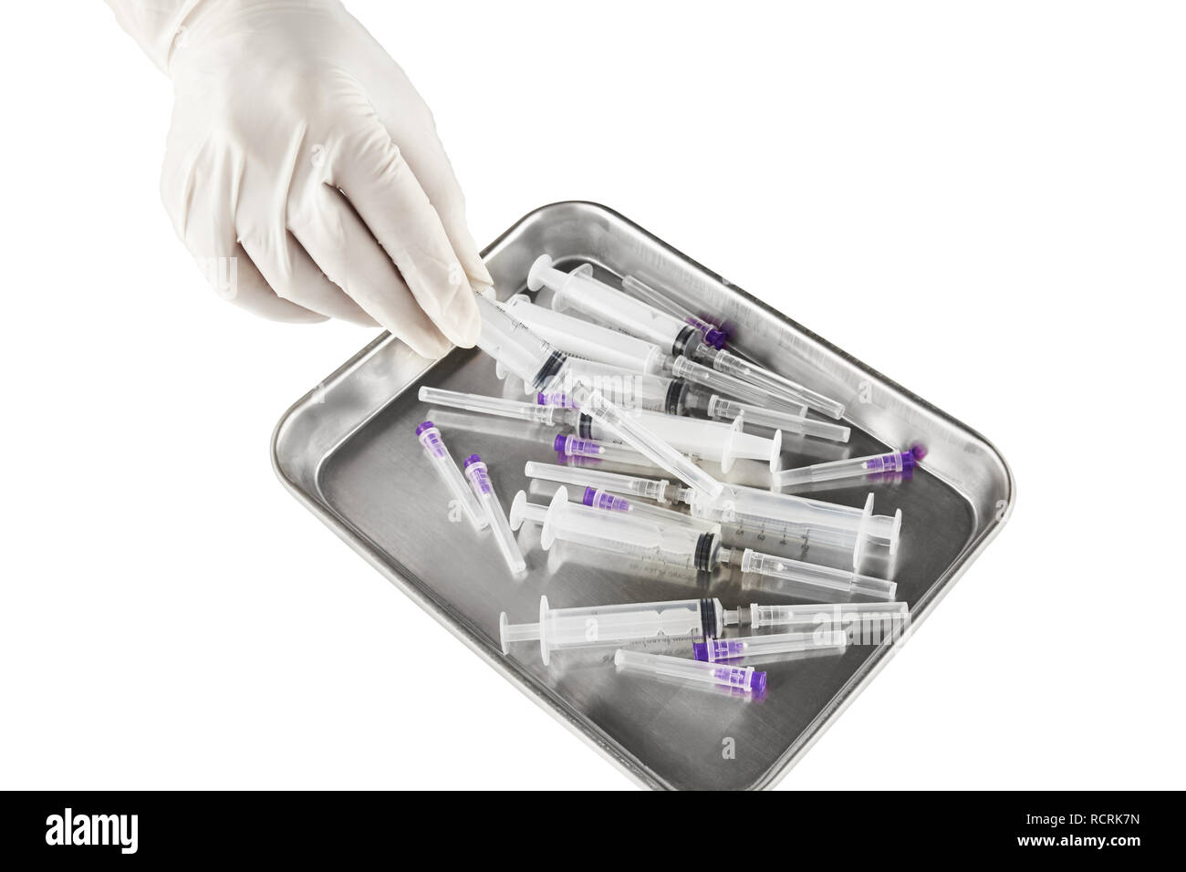 Metal salver with syringes and needles. Isolated on white background ...