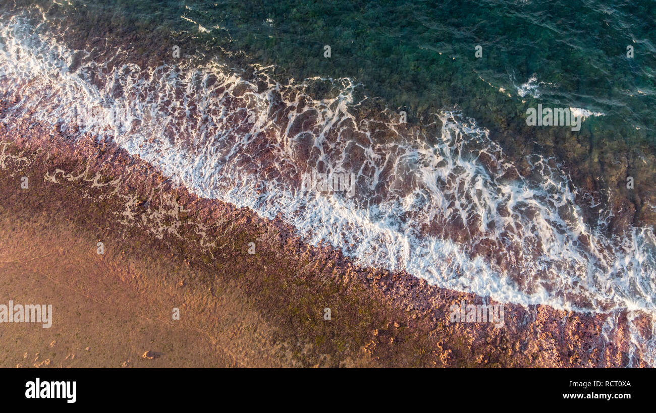 Aerial view of a reef break Stock Photo - Alamy