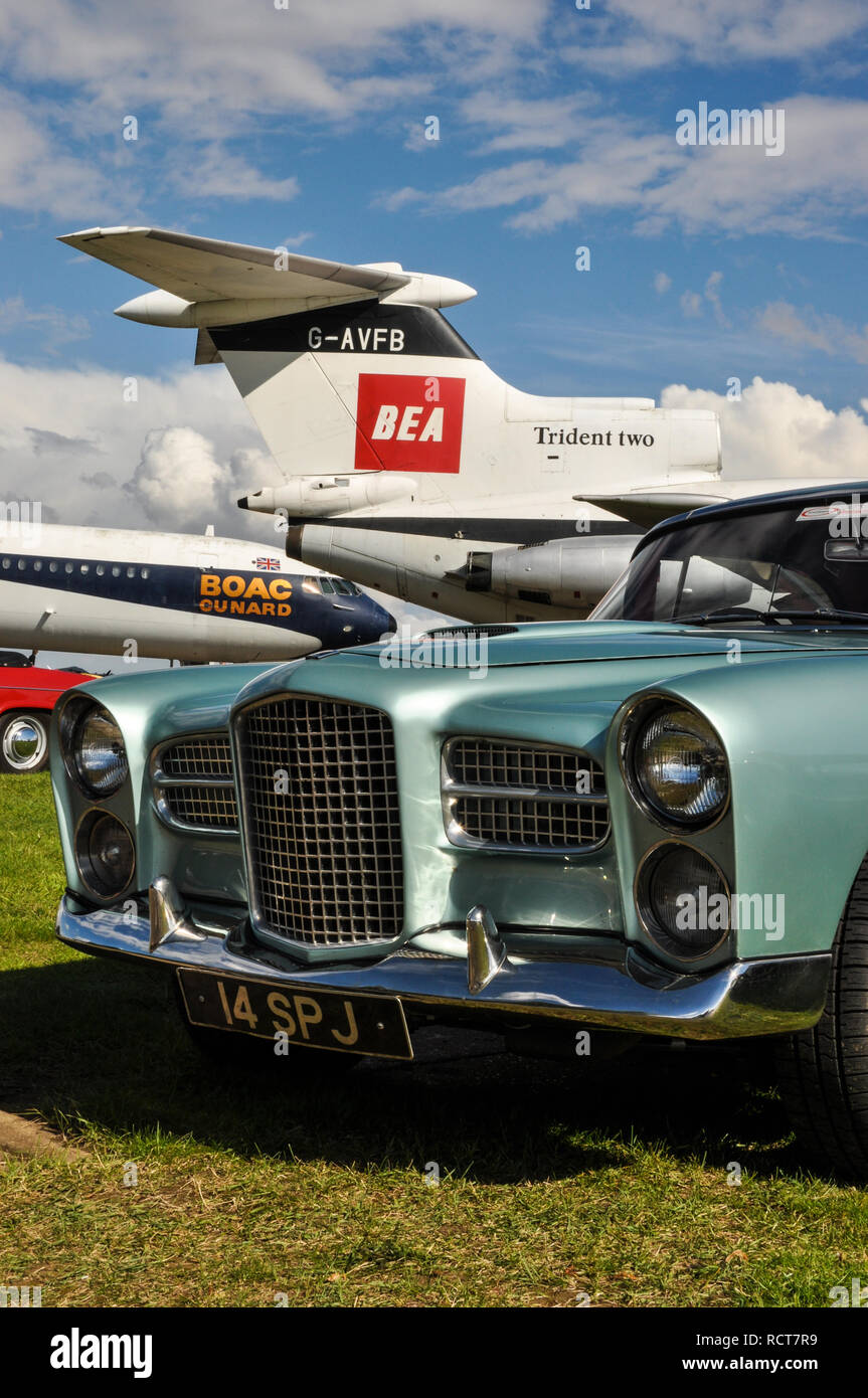 Vintage plane and car. Classic airliner BEA Hawker Siddeley Trident Two ...