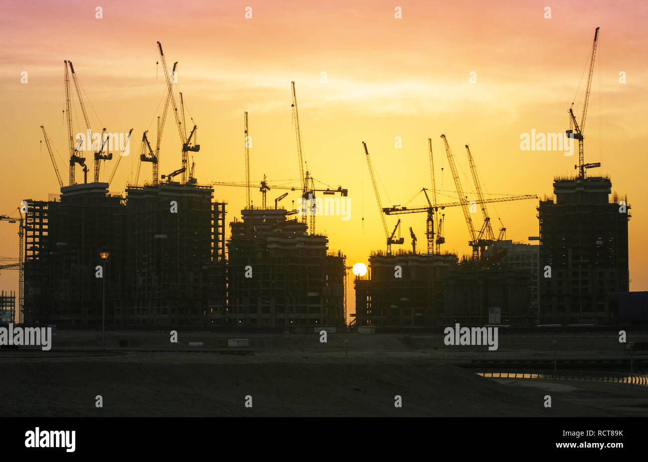 An expanse of cranes during the building boom in Dubai Stock Photo - Alamy