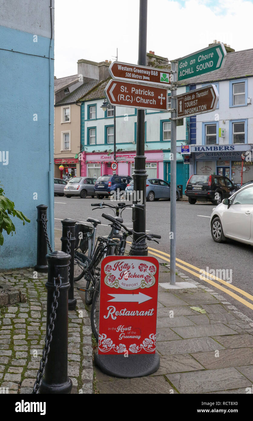 Rural street scene in Ireland with tourist signs in a small Irish town ...
