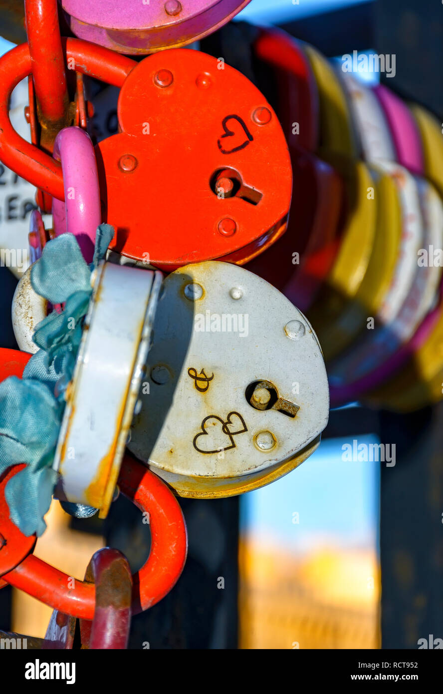 Lovers locks on the pole of the bridge and key thrown into the river ...