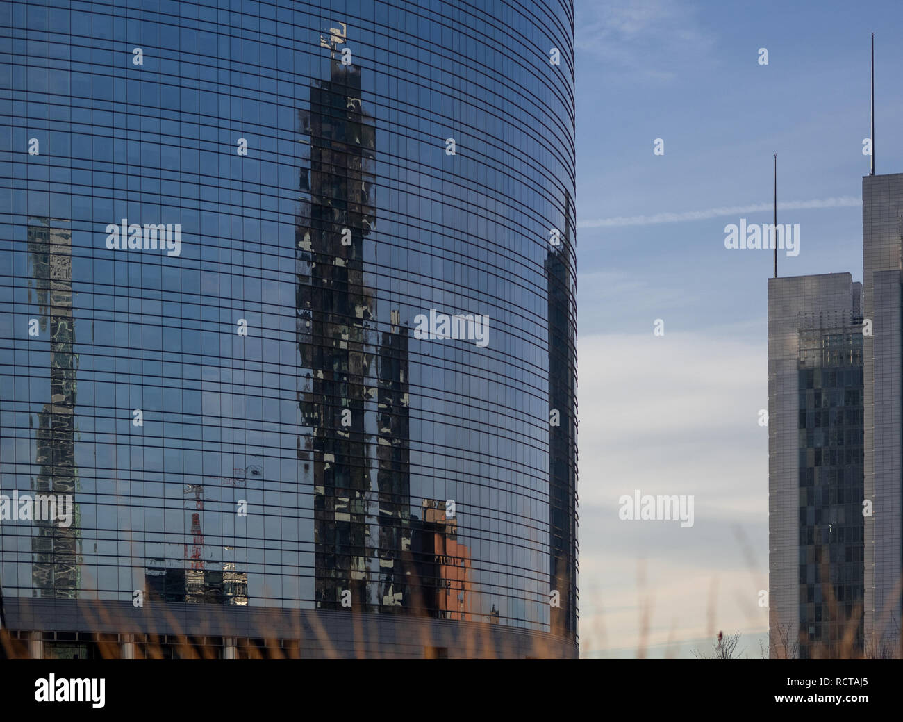 Milan - Italy, skyscrapers that are reflected in other skyscrapers in ...