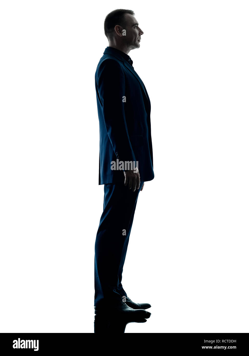 one caucasian business man standing silhouette isolated on white background Stock Photo - Alamy