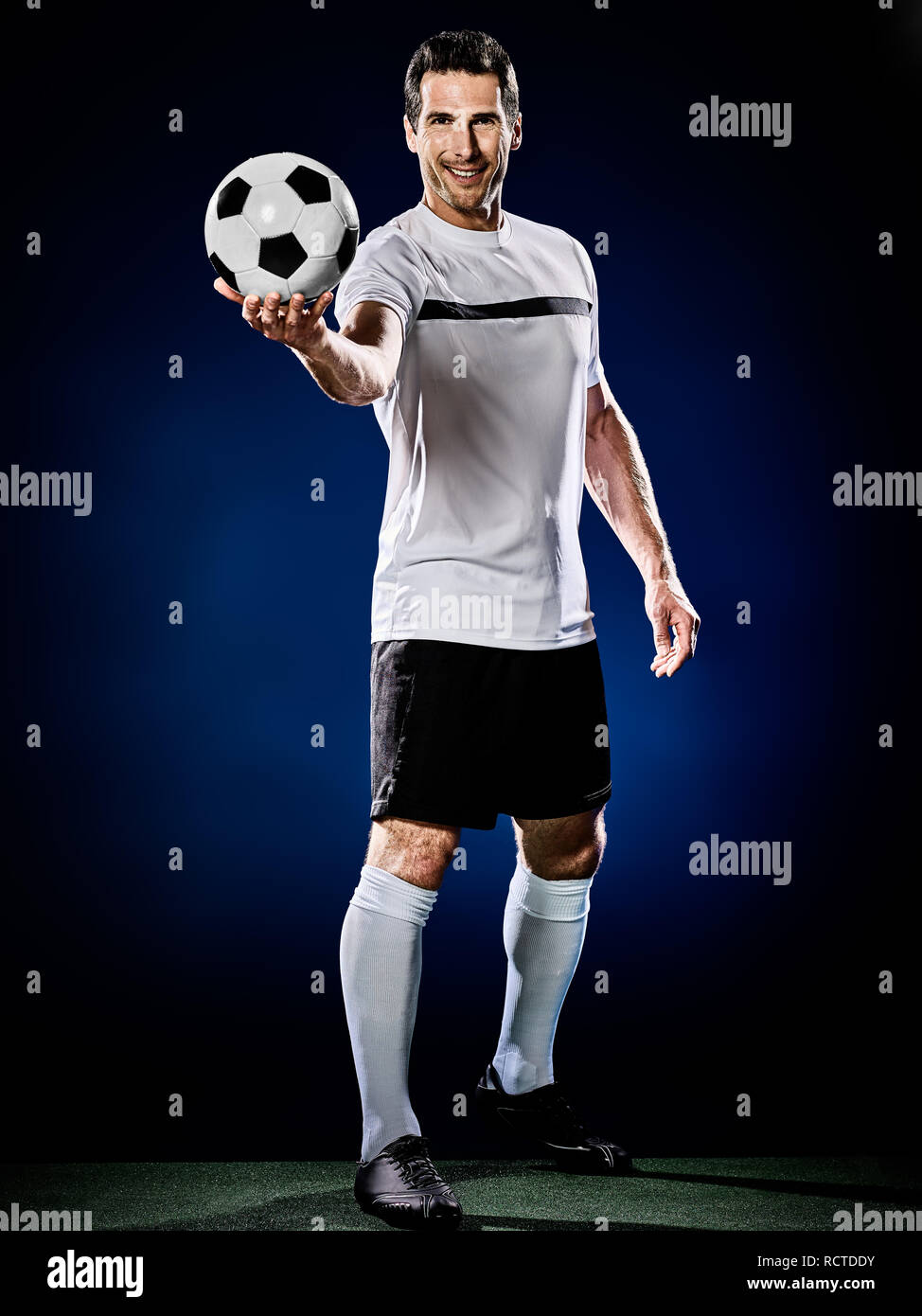 one caucasian soccer player man isolated on black background Stock ...