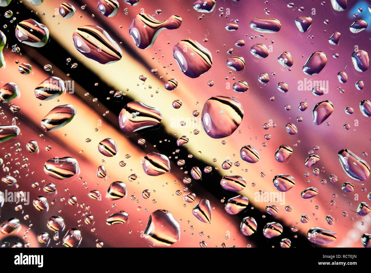 Water drops on colorful background Stock Photo - Alamy