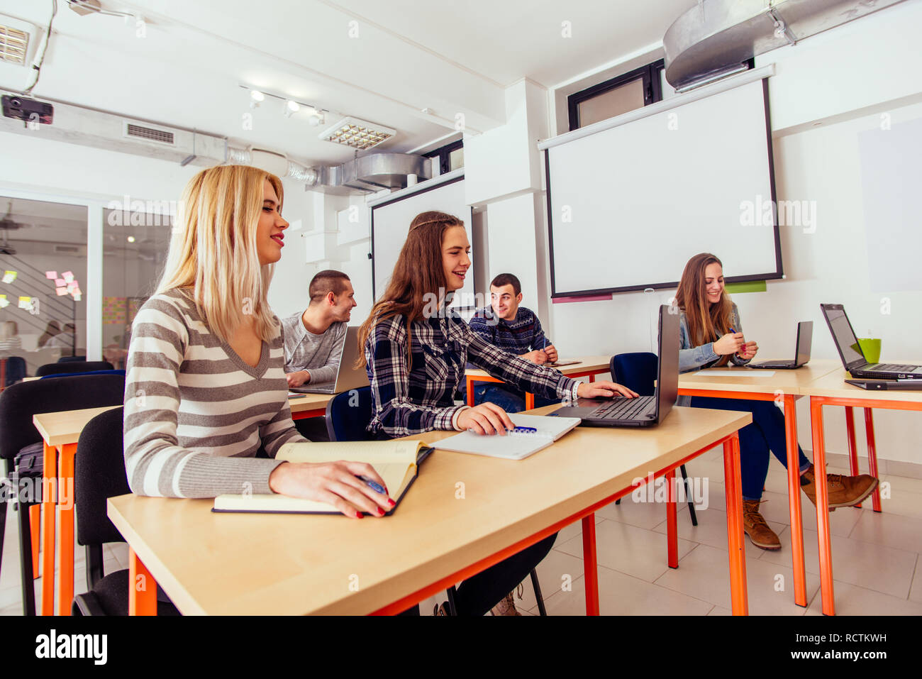 Young students are in classroom, they are looking interested Stock ...