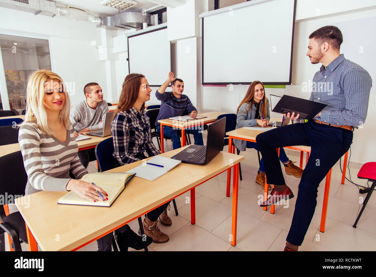 Group of students are in class, listening to a lecture Stock Photo - Alamy