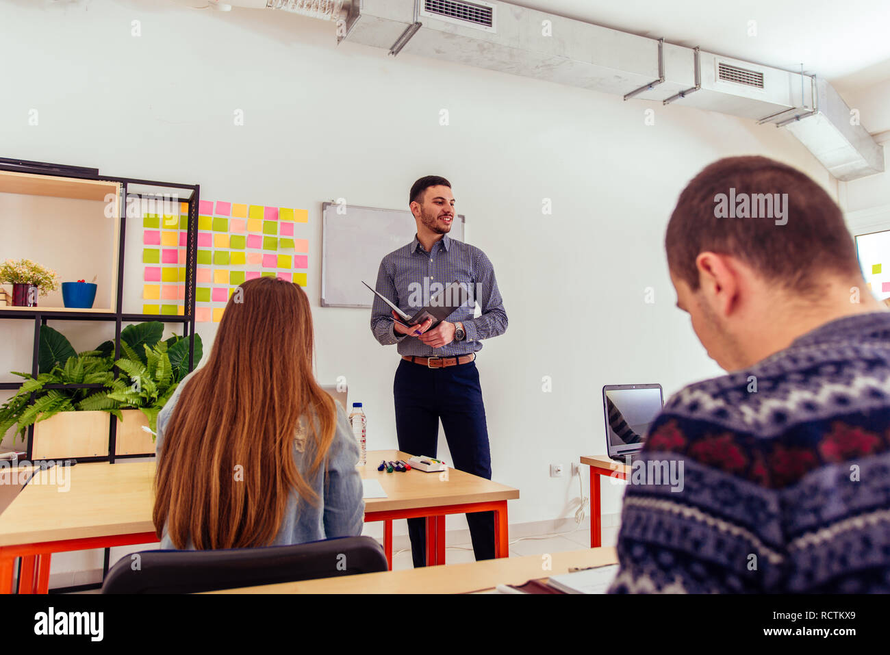 Young students are in classroom, they are looking interested Stock ...