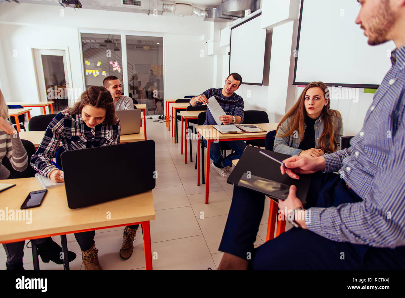 Group of students are in class, listening to a lecture Stock Photo - Alamy