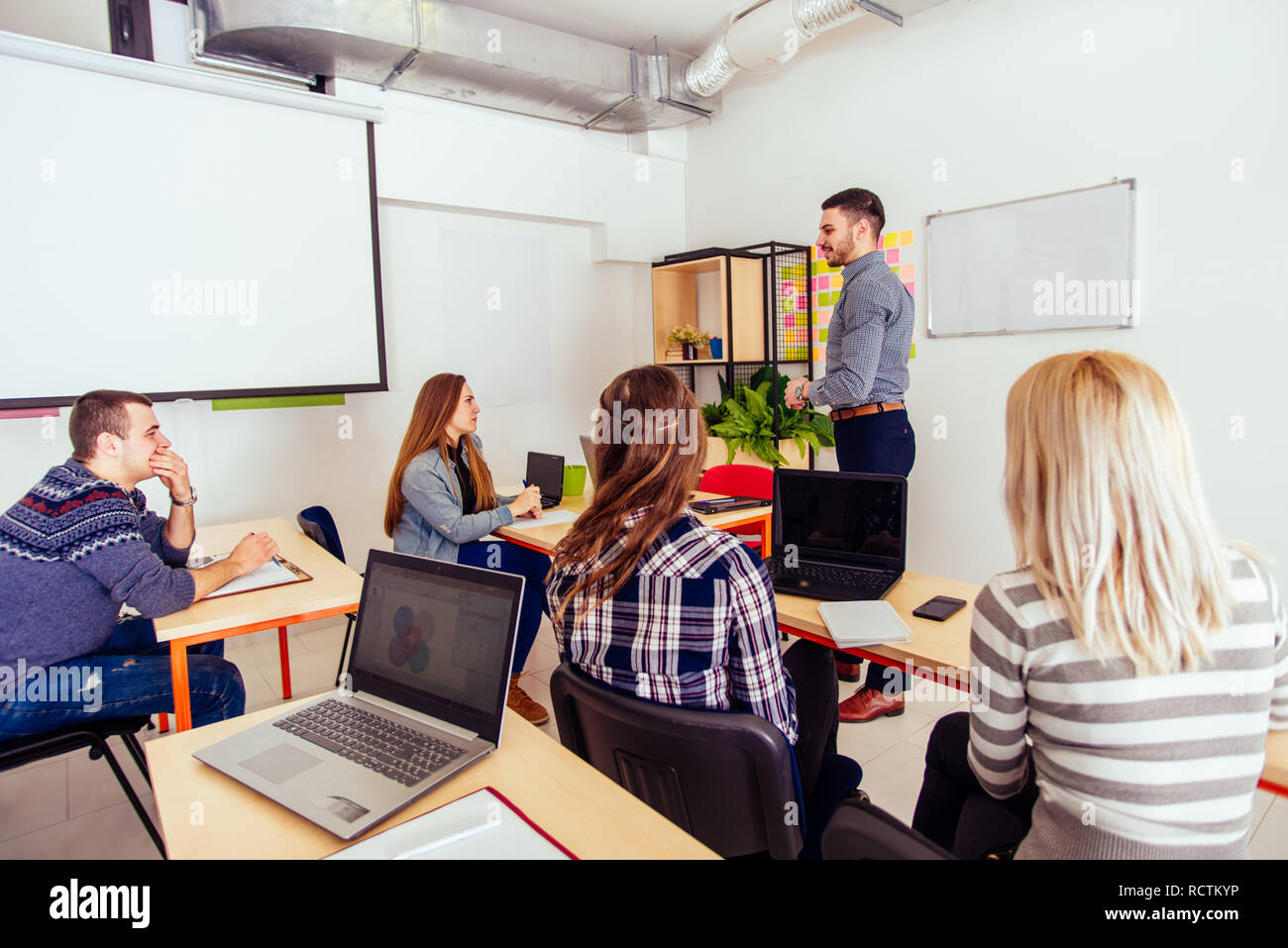 Young students are in classroom, they are looking interested Stock ...