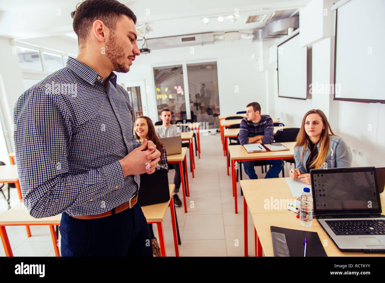 Group of students are in class, listening to a lecture Stock Photo - Alamy