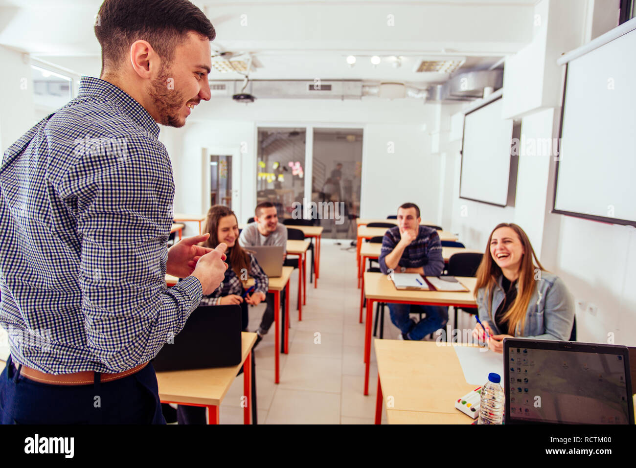 Young students are on class and listening carefully their teacher Stock ...