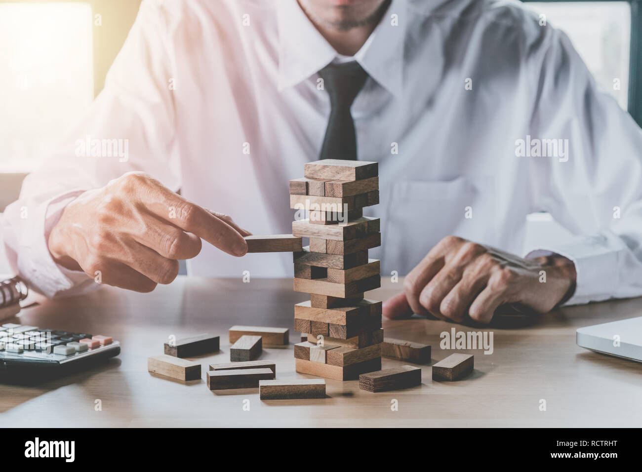 Businessman pulling falling hi-res stock photography and images - Alamy