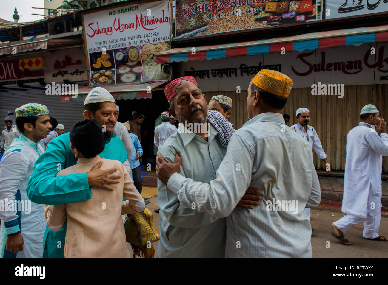 Muslim men greet each other by embracing after offering prayers on Eid ...