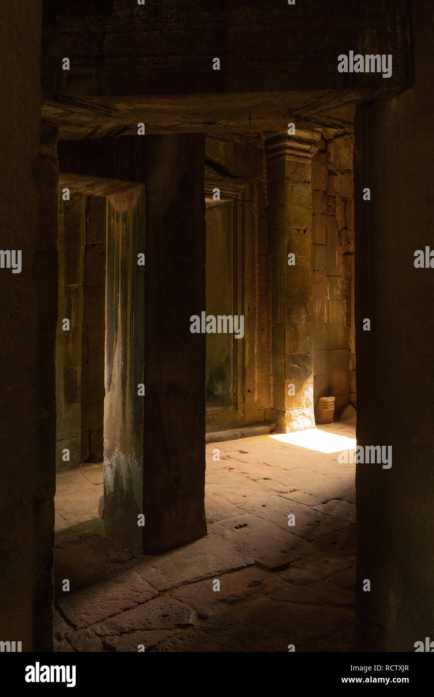 Inside of stone temple lit by sunlight Stock Photo - Alamy