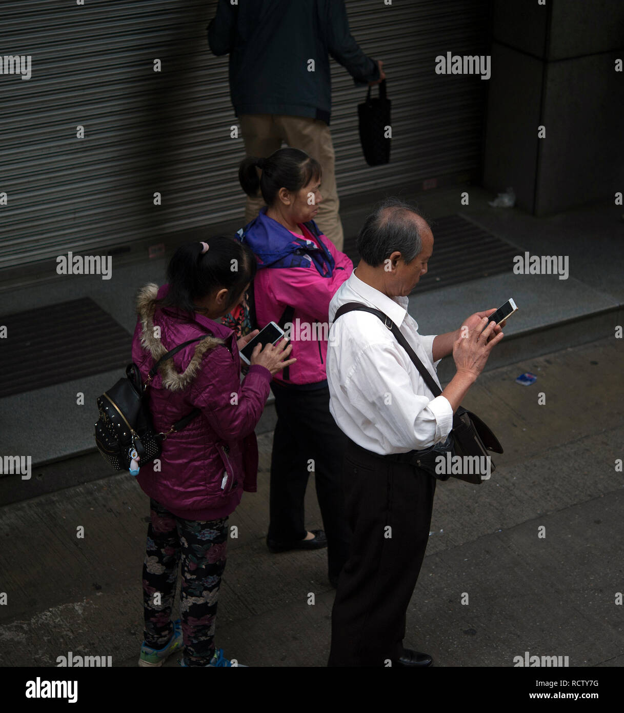 Chinese shoppers on their mobile phones, Hong Kong, China, South East ...