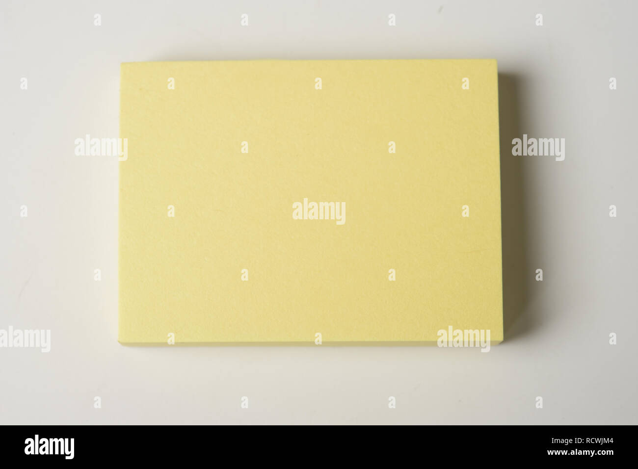 Small yellow paper to write Note Stock Photo - Alamy