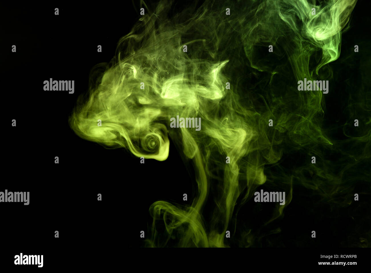 Colorful green smoke on a black isolated background. Background from ...