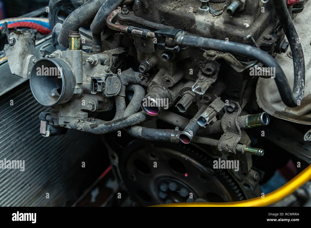 Close-up of the engine, throttle, raditor. Engine breakdown: pink ...