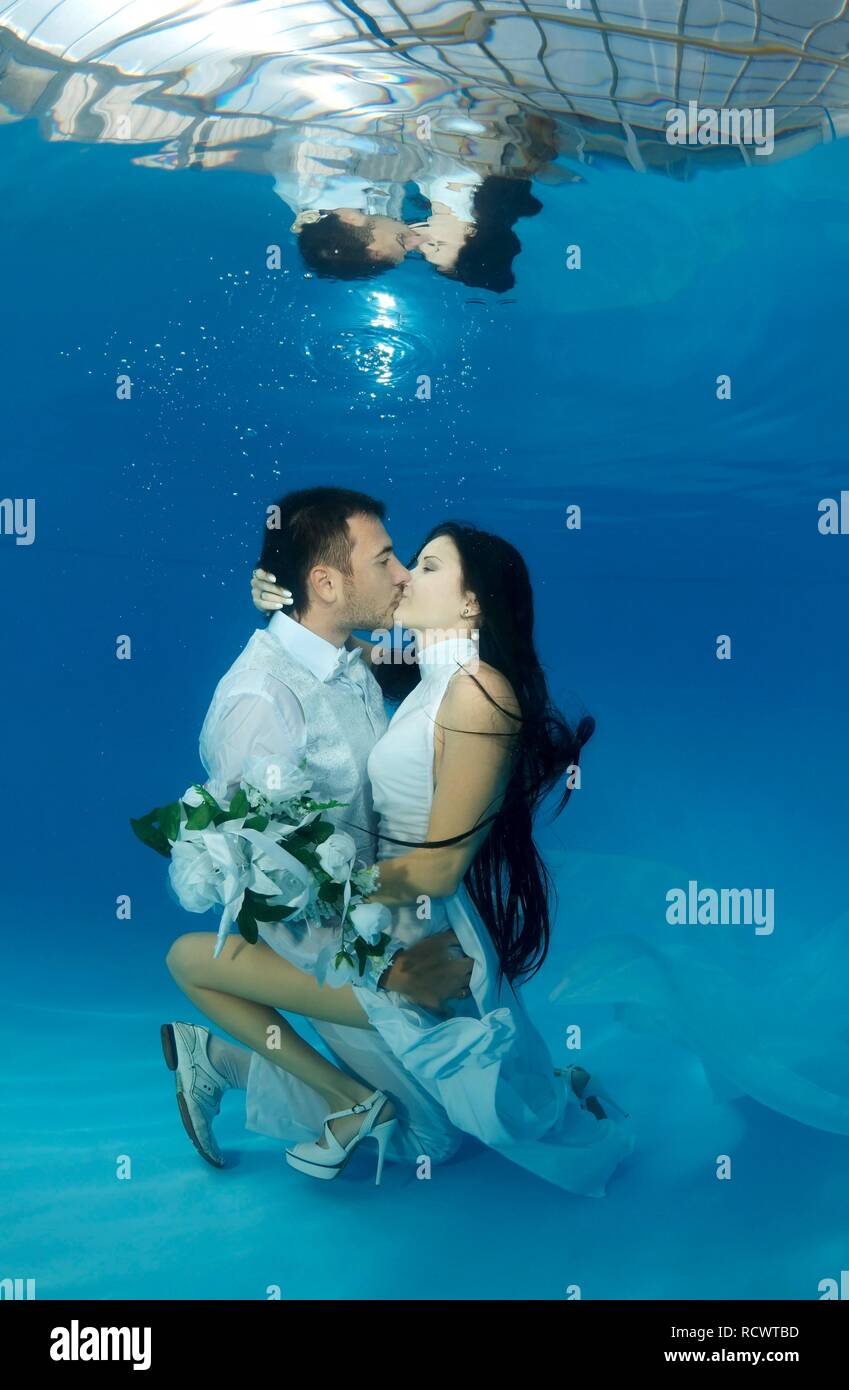 Bride and groom, underwater wedding in a pool Stock Photo - Alamy
