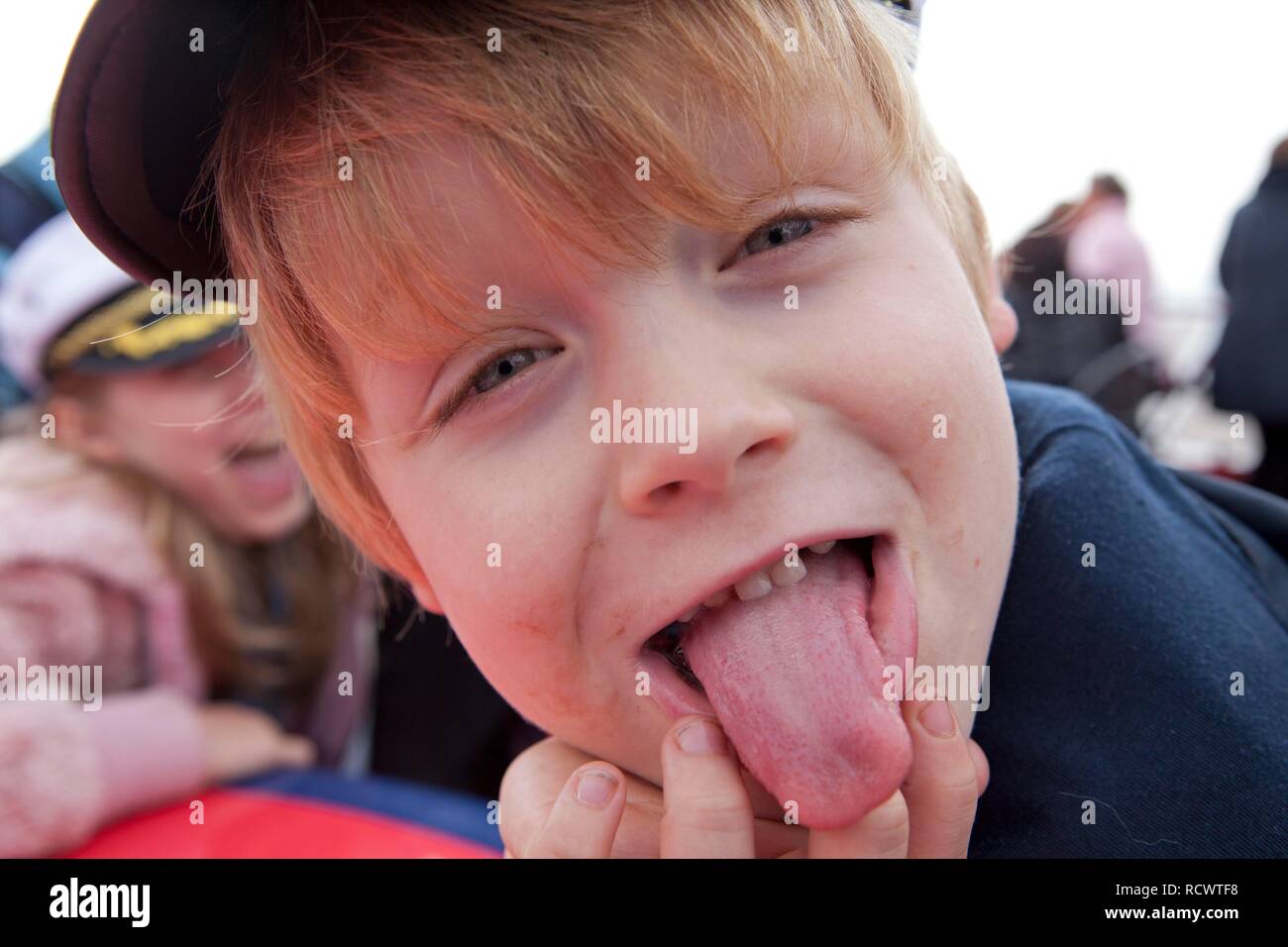 Poke poking stick sticking tongues tongue out hi-res stock photography ...