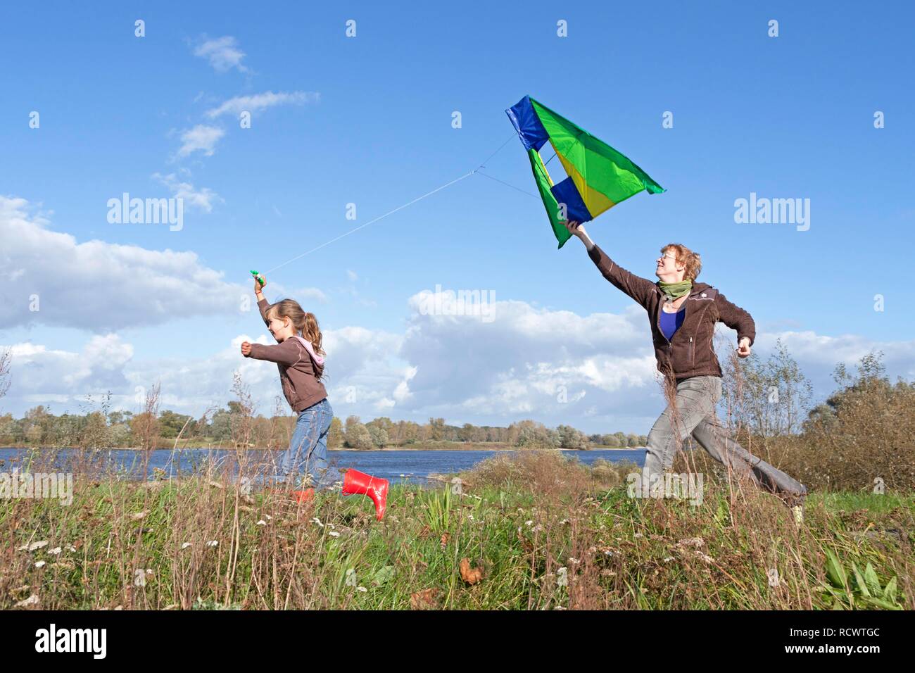 Girl and woman flying a kite, kiteflying, Hitzacker, Lower Saxony Stock ...