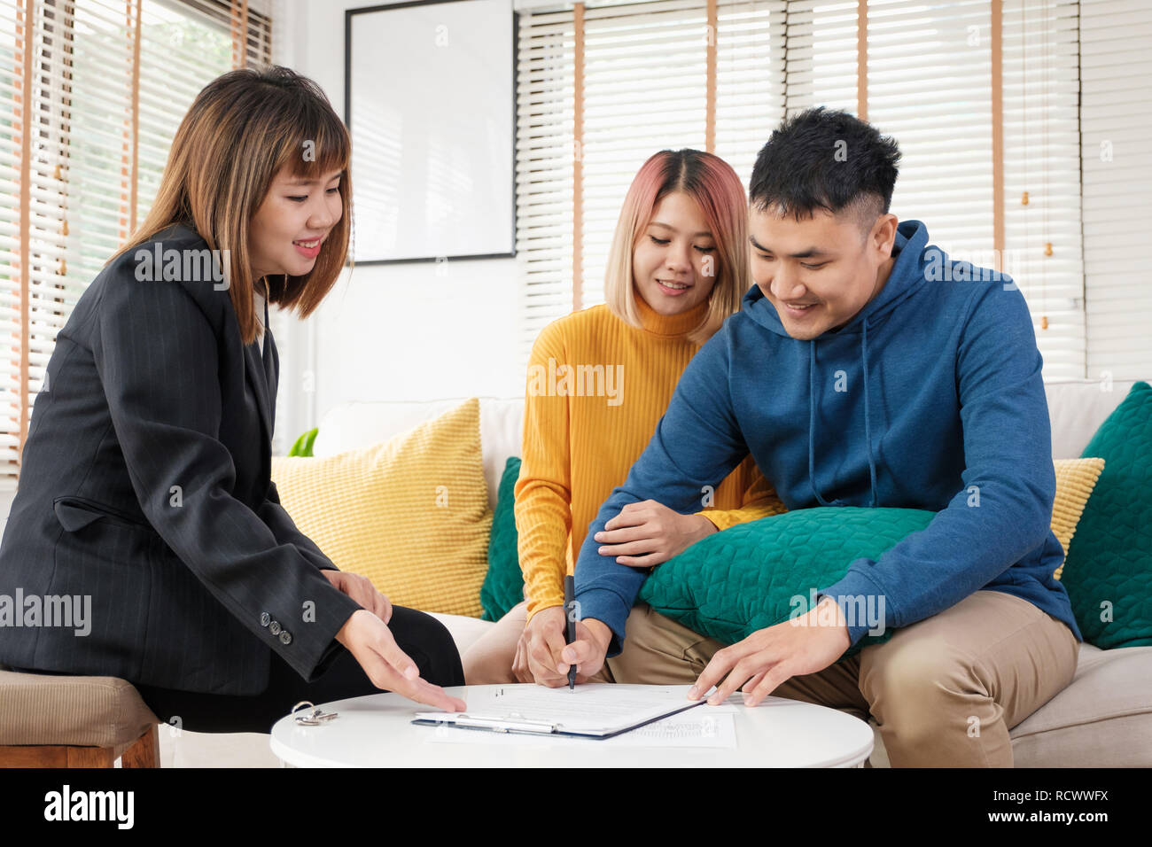 Real estate agent asian family hi-res stock photography and images - Alamy